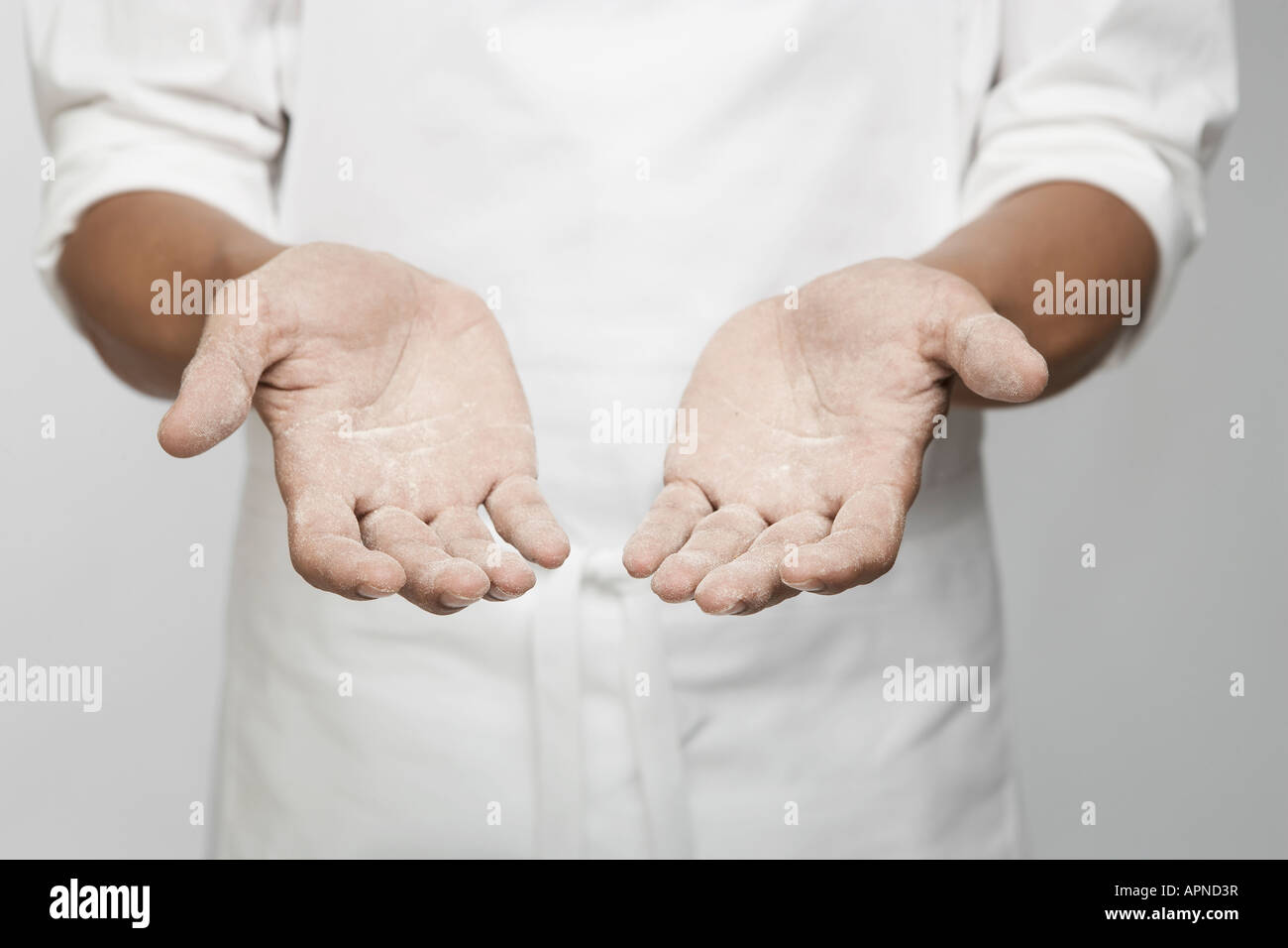 Flour on chef's hand (mid section Stock Photo - Alamy