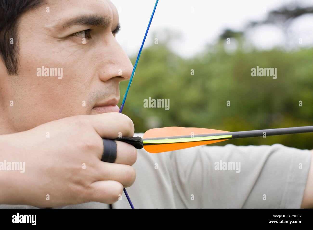 Mid adult man arrow shooting (close-up Stock Photo - Alamy