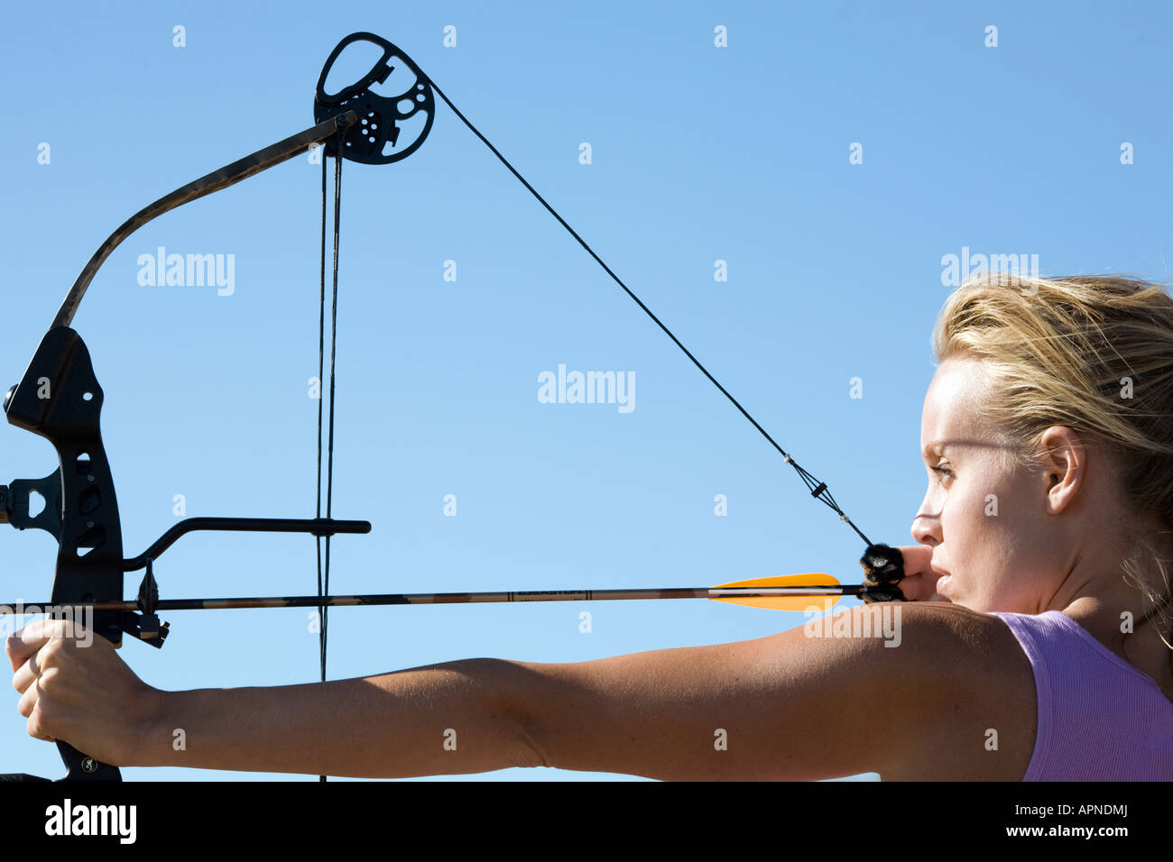 Young woman arrow shooting Stock Photo - Alamy