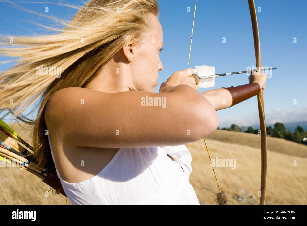 Young woman arrow shooting Stock Photo - Alamy