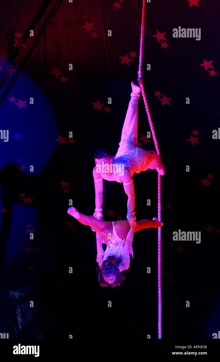 Circus acrobats performing inside the big top daring exciting dangerous ...