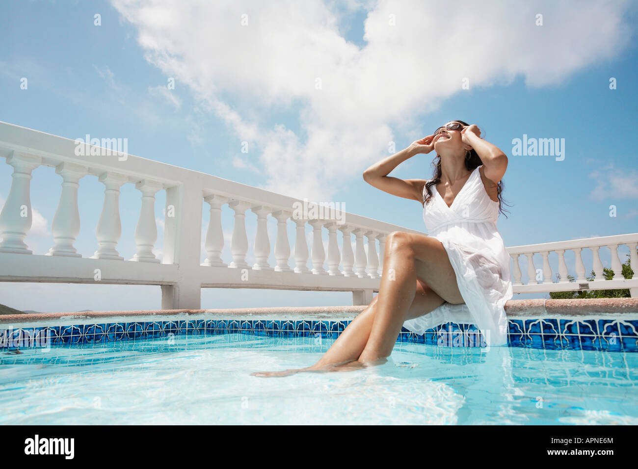 Hands on edge of swimming pool hi-res stock photography and images - Alamy