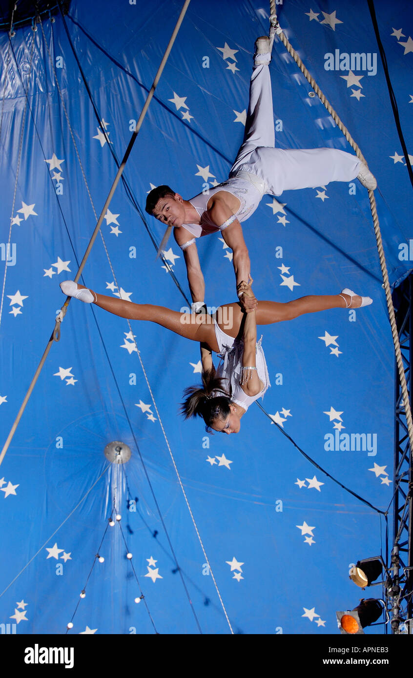 Circus acrobats performing inside the big top Stock Photo - Alamy