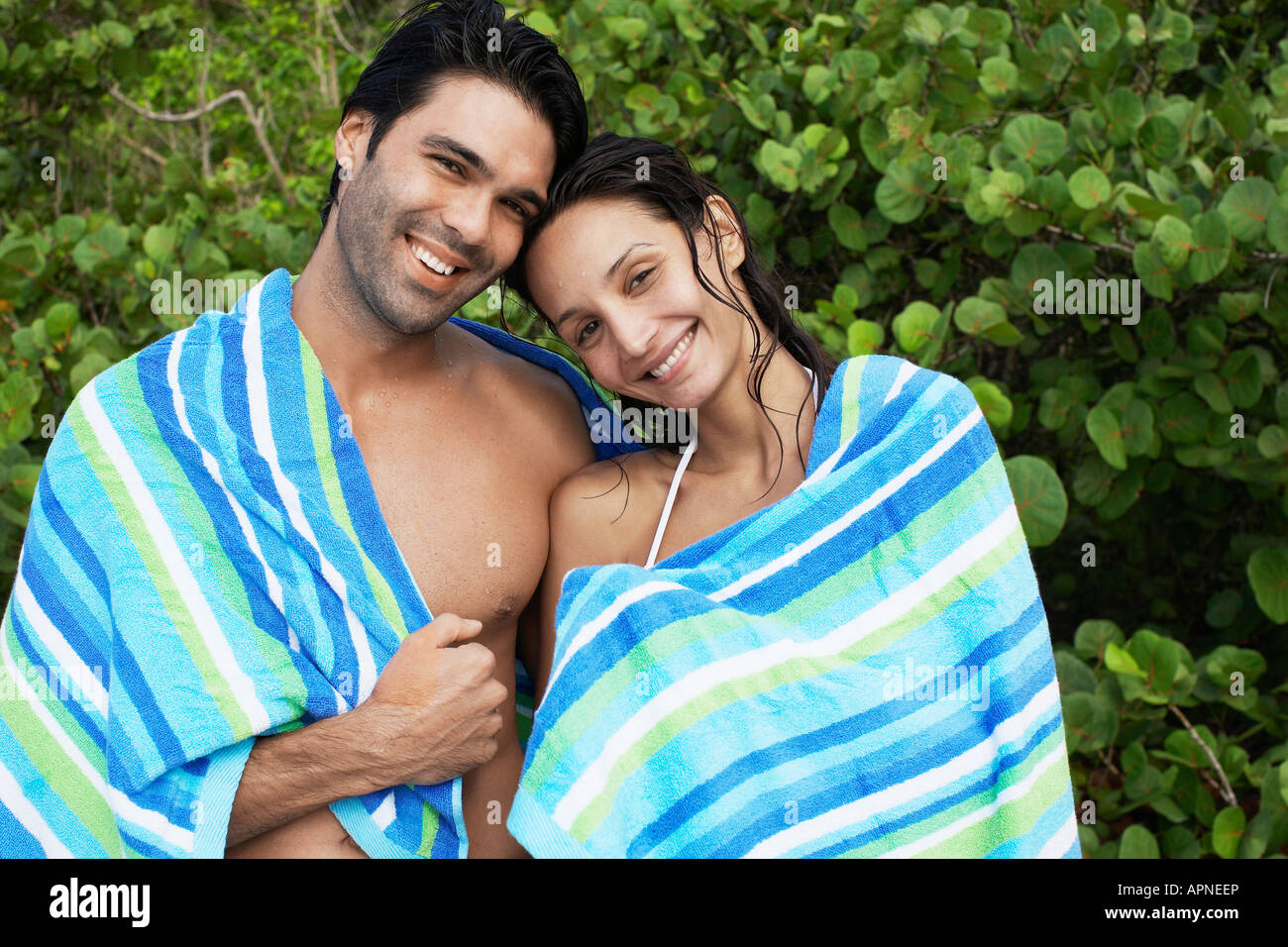 Young couple wrapped in towel (portrait Stock Photo - Alamy