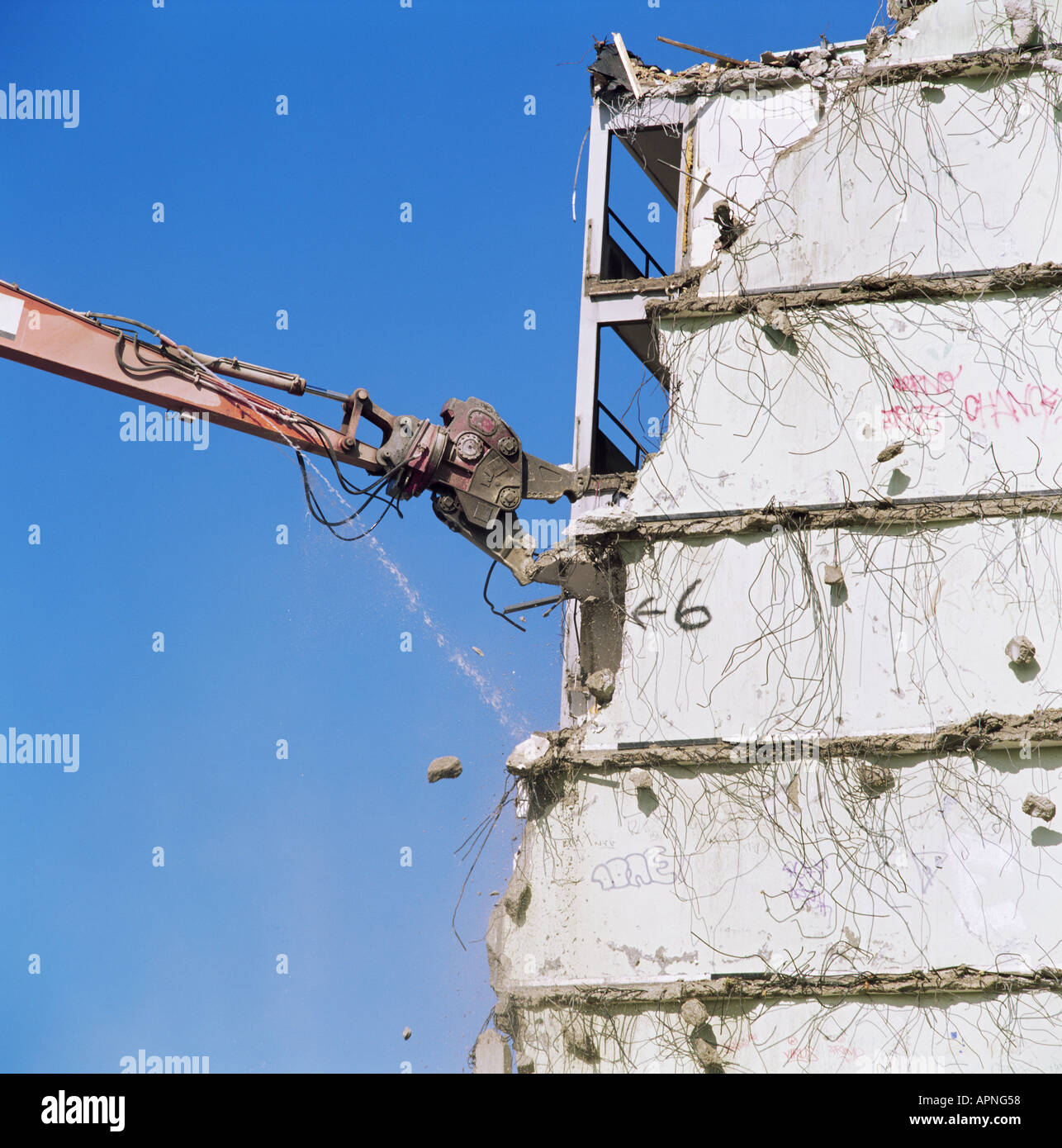 Crane demolishing a building Stock Photo - Alamy