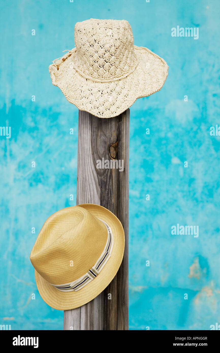 Two straw hats on pole Stock Photo - Alamy