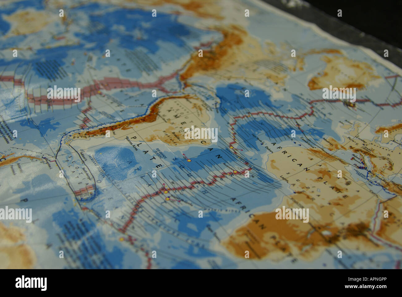 A laminated paper map with South America in focus Stock Photo - Alamy