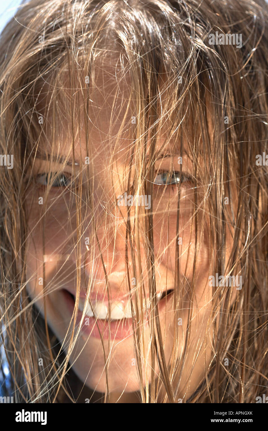 Hair covering woman's face Stock Photo - Alamy