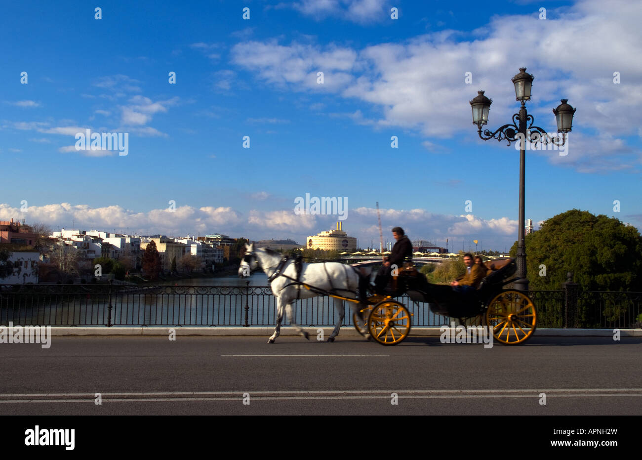 Beautiful river scene with tourist ride horse carriage of downtown city ...
