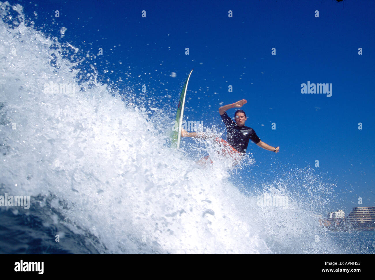 SURFING GIRL WOMAN ACTION Stock Photo - Alamy