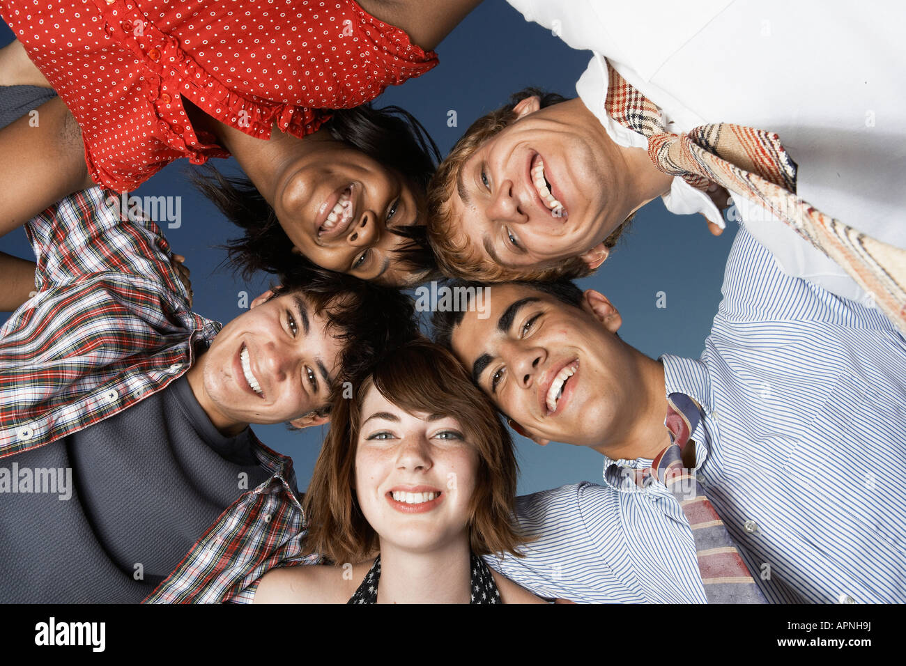 Girls in huddle looking at camera hi-res stock photography and images ...