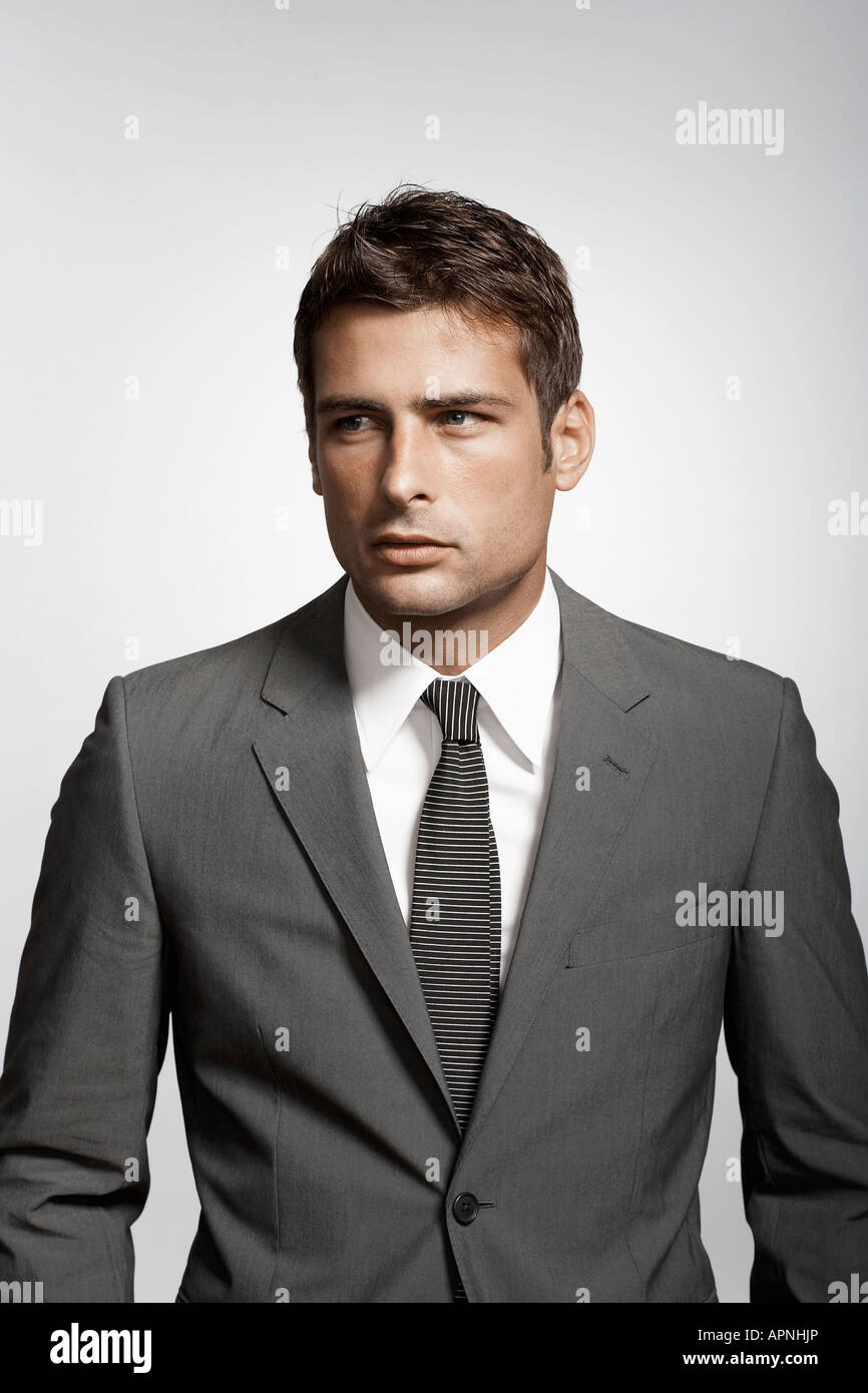 Portrait of mid adult man in suit Stock Photo - Alamy