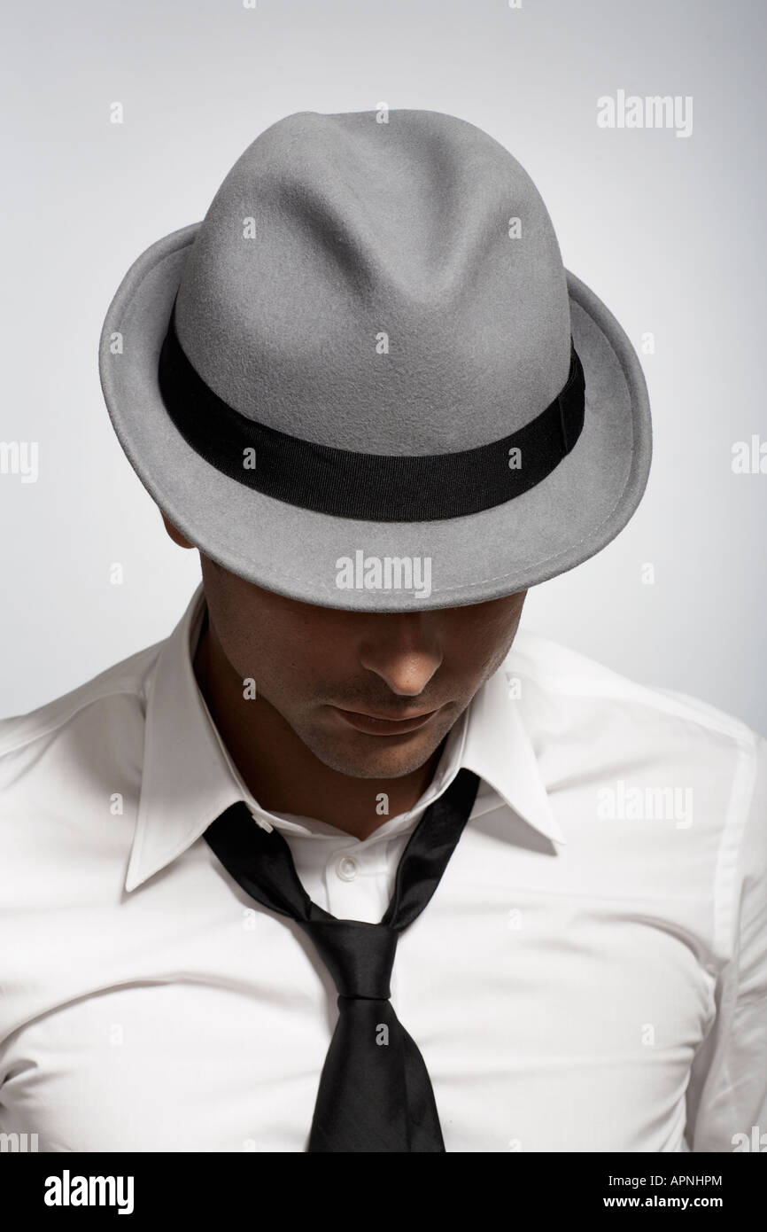 Mid adult man wearing fedora Stock Photo - Alamy