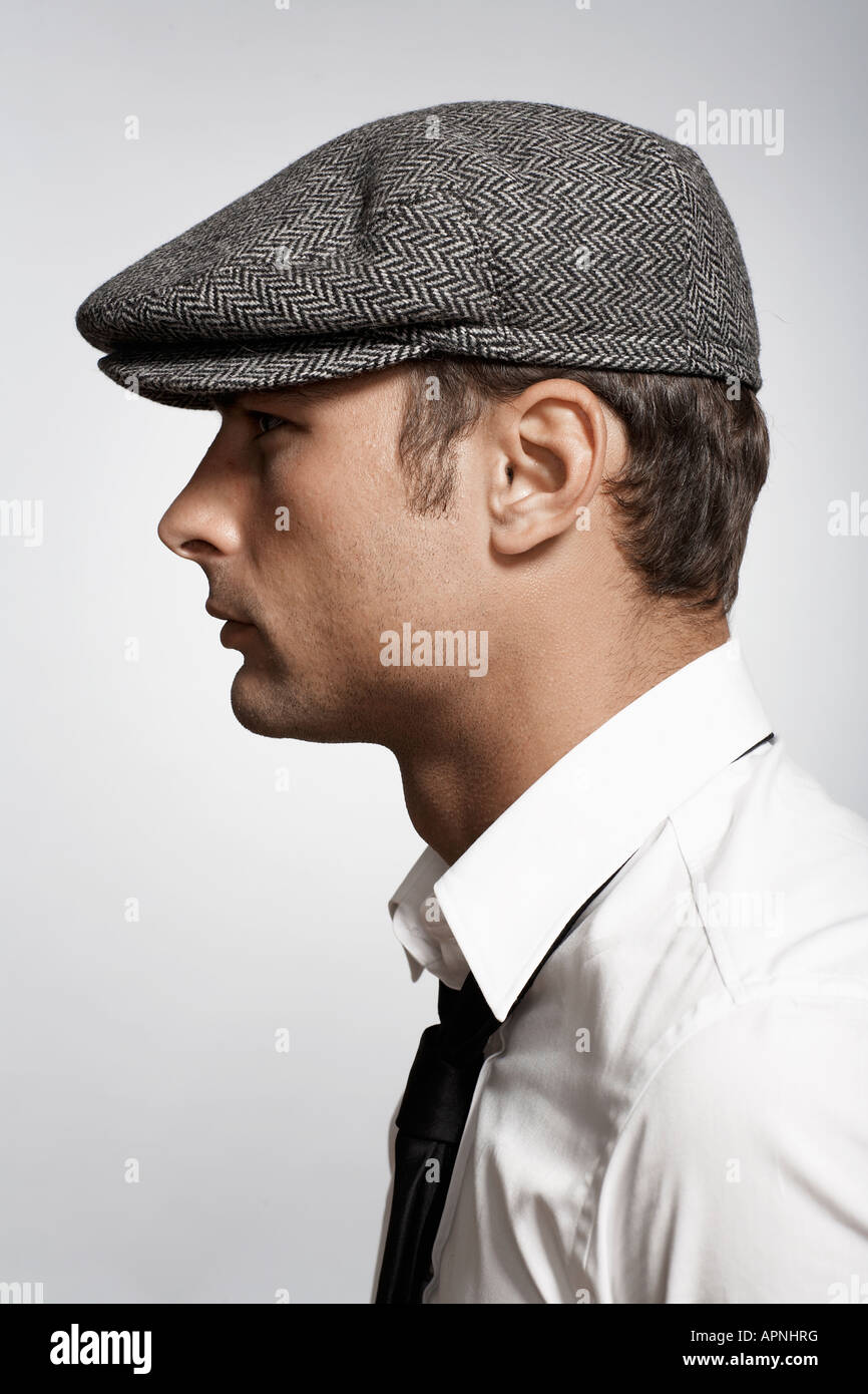 Profile of mid adult man wearing cap Stock Photo - Alamy