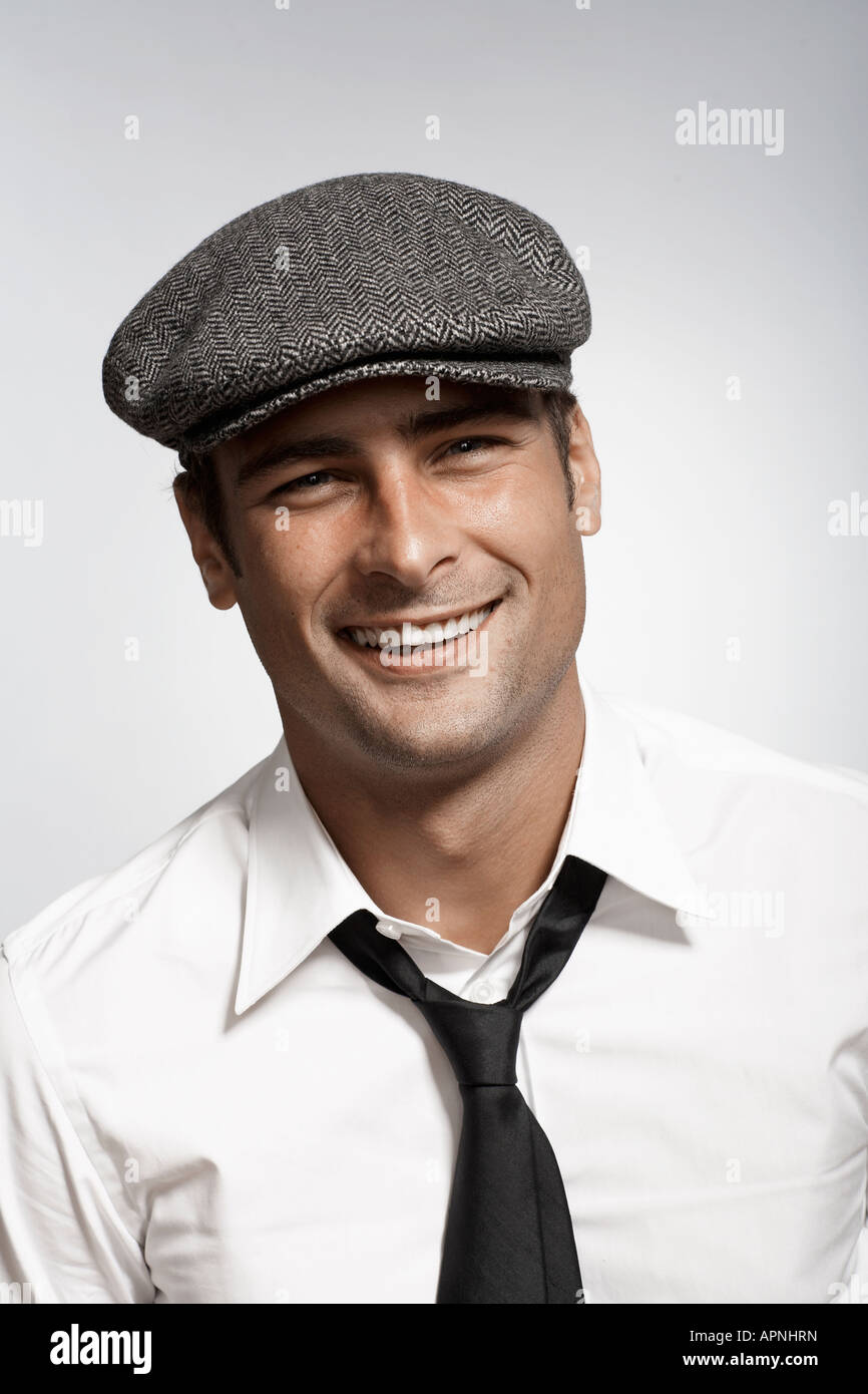Mid adult man with cap smiling Stock Photo - Alamy