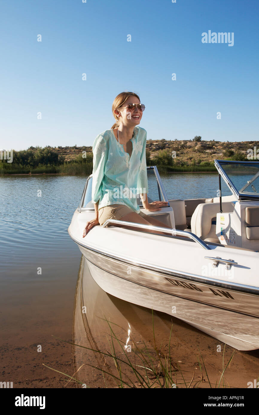 Young woman in motorboat Stock Photo - Alamy