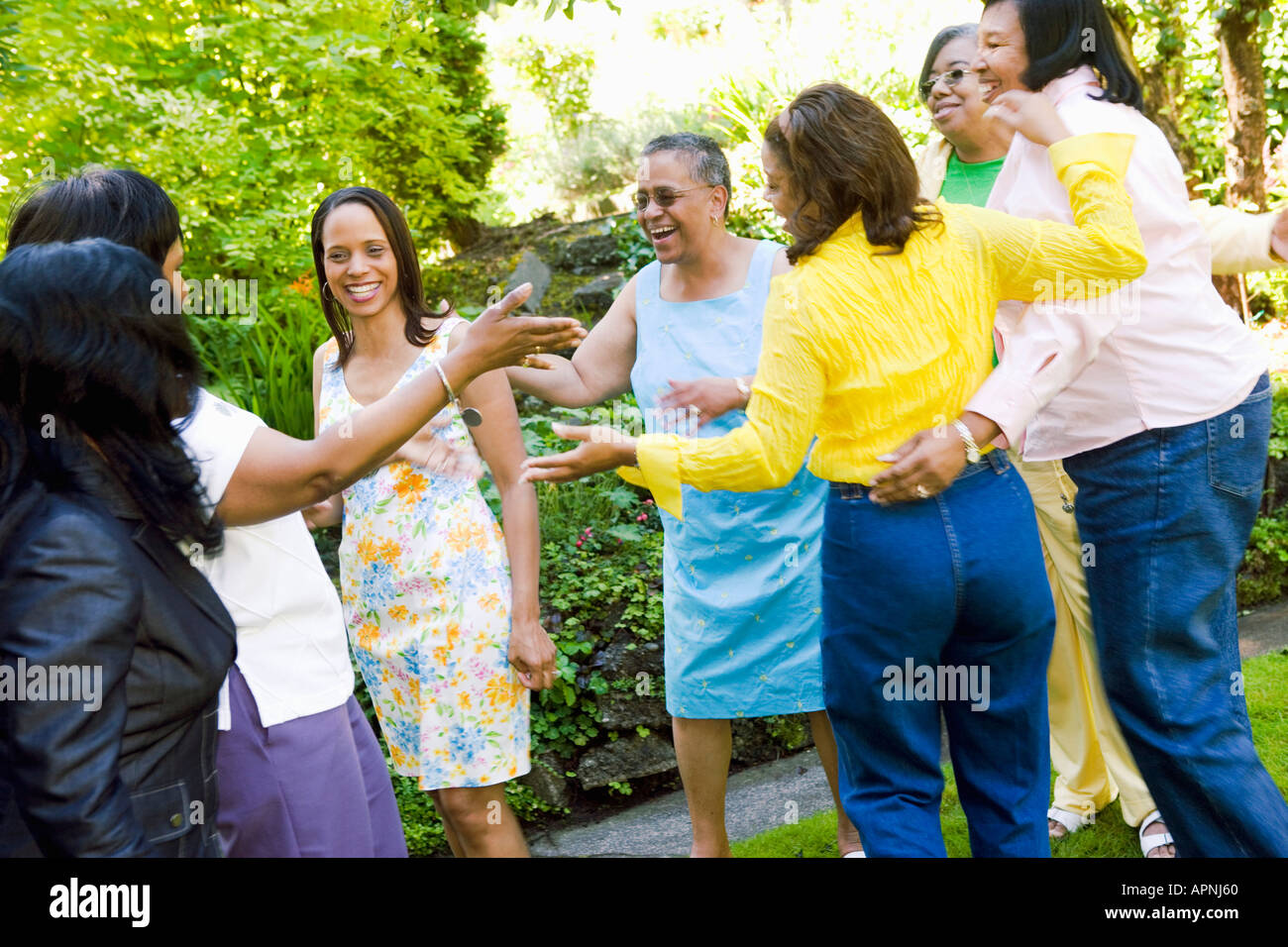Female family members hugging Stock Photo - Alamy