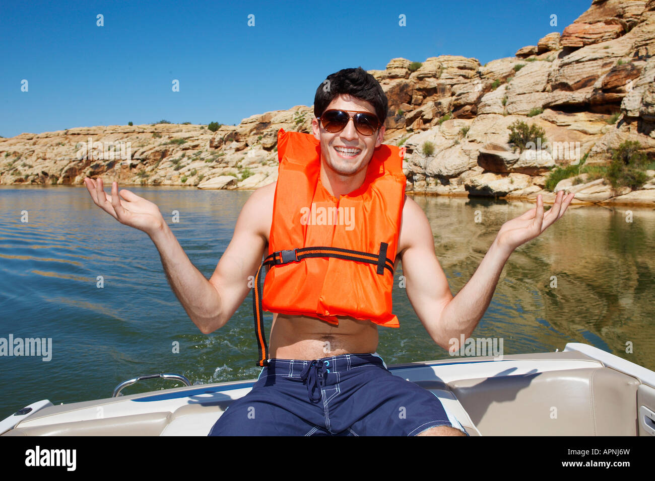 Young man in life jacket Stock Photo - Alamy