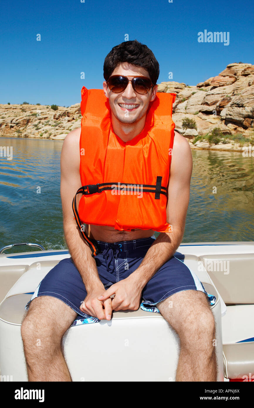 Young man in life jacket Stock Photo - Alamy