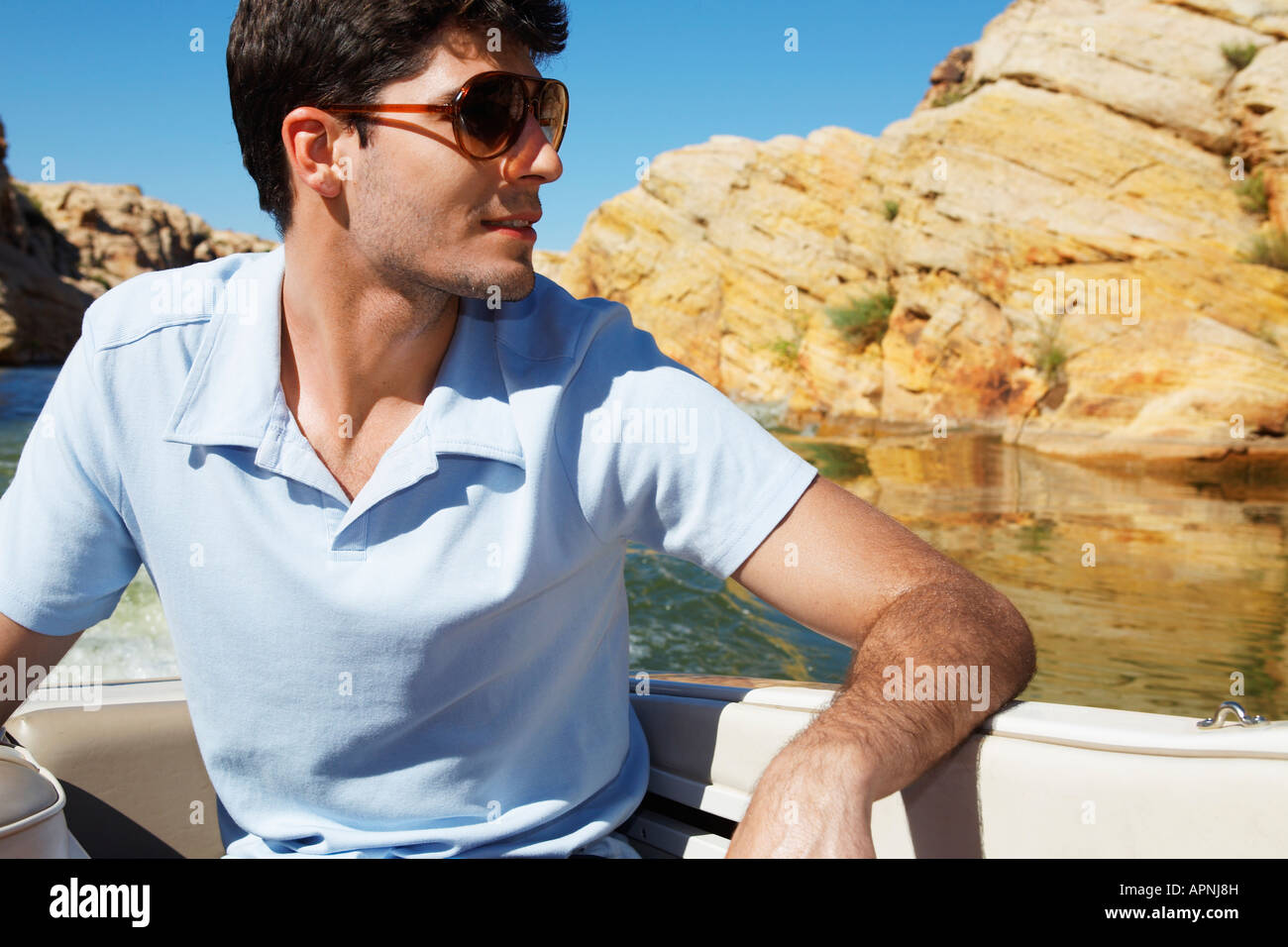Young man in motorboat Stock Photo - Alamy
