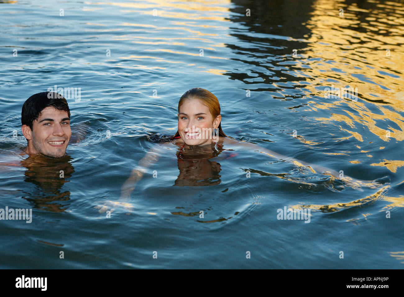 Couple swimming in lake hi-res stock photography and images - Alamy