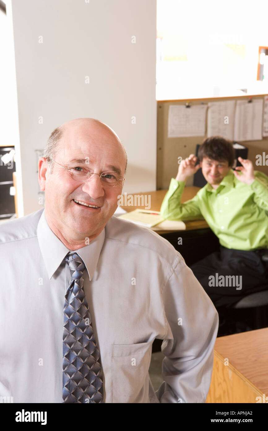Employee making fun of boss Stock Photo - Alamy Employee making fun of boss Stock Photo - Alamy