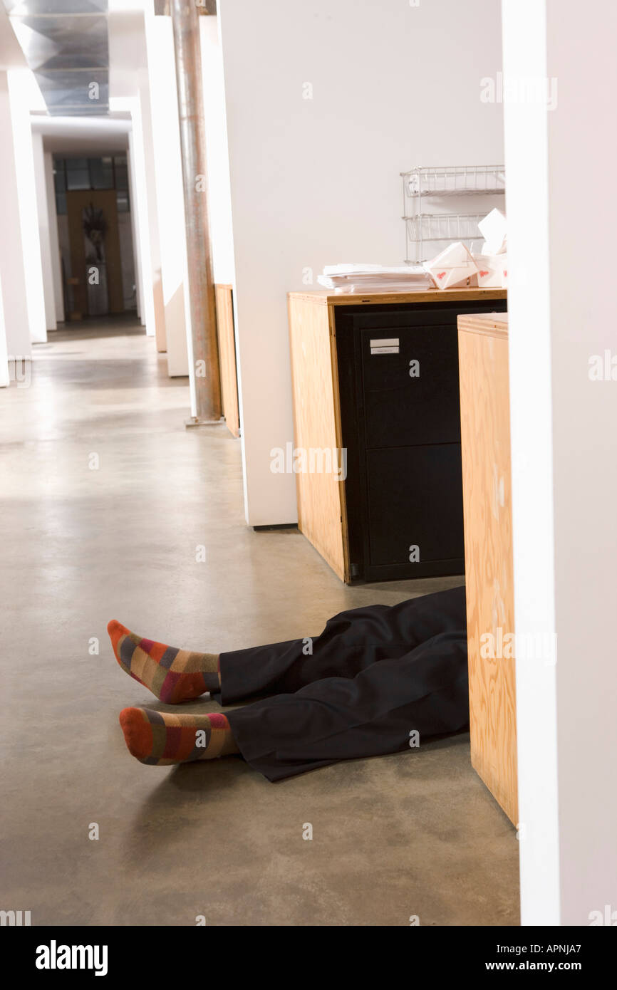 Prone body of a male office worker Stock Photo - Alamy