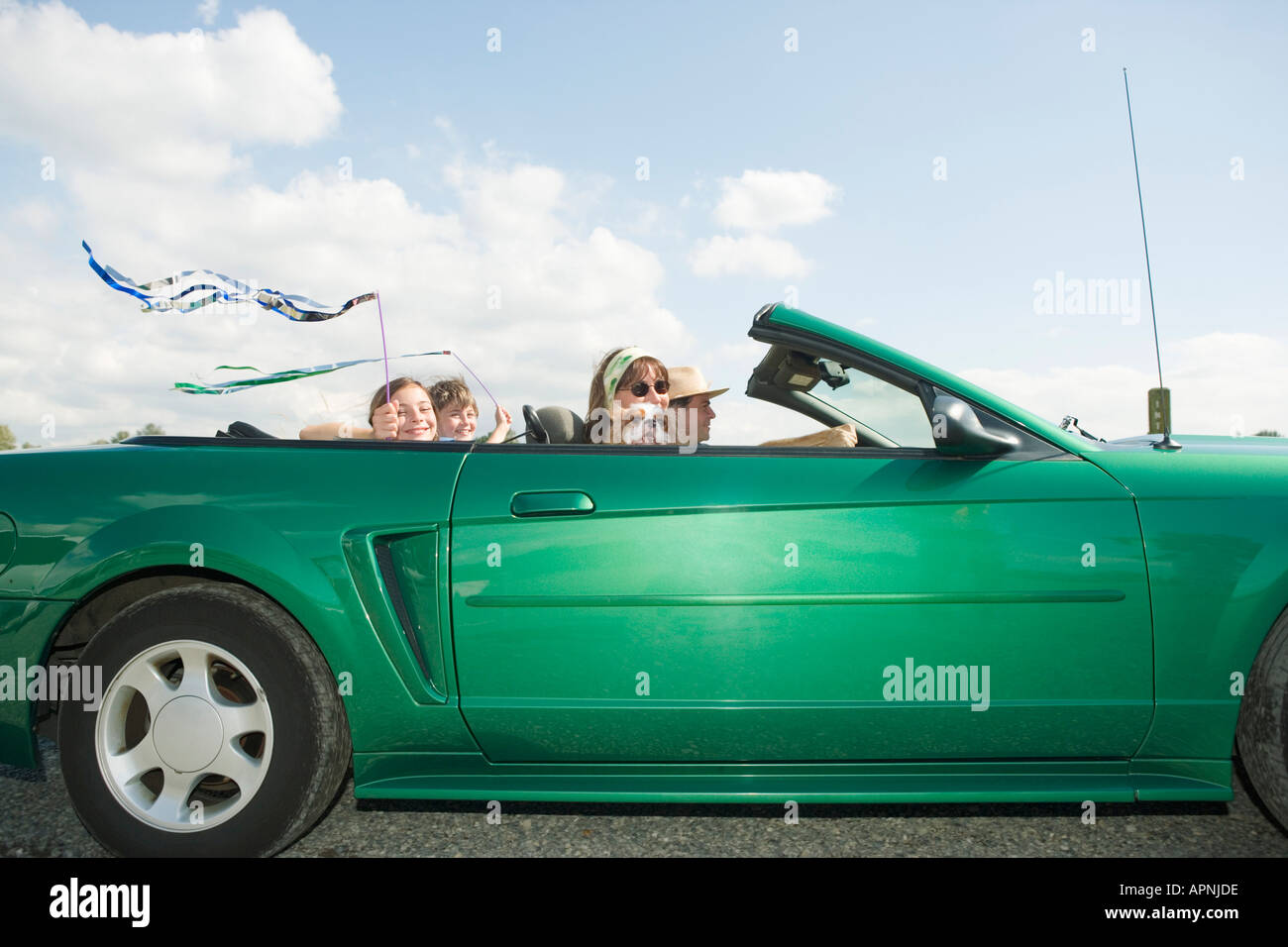 Family riding in convertible car Stock Photo - Alamy