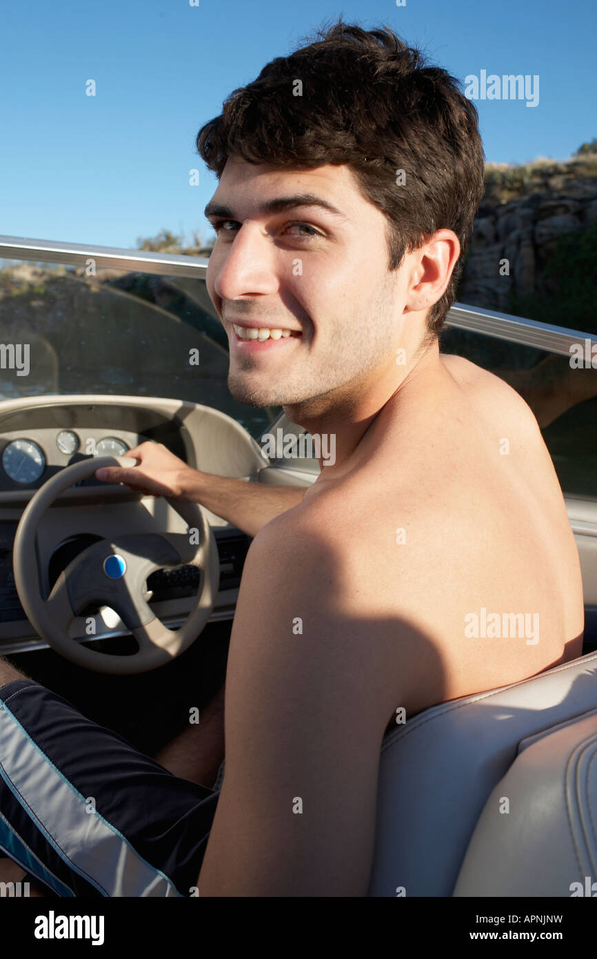Young man driving beach buggy Stock Photo - Alamy