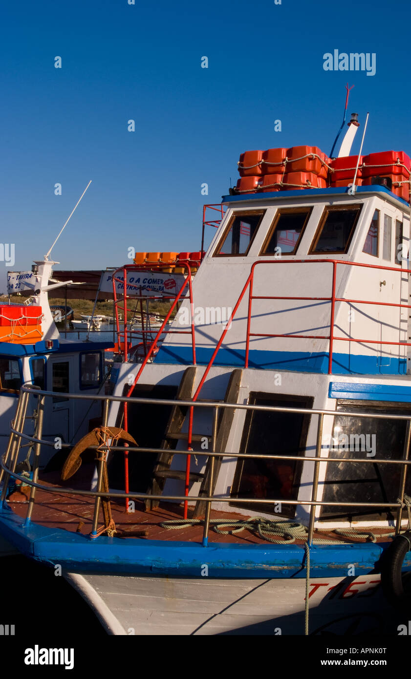 Close up of colorful fishing boat in small village of Tavira in ...