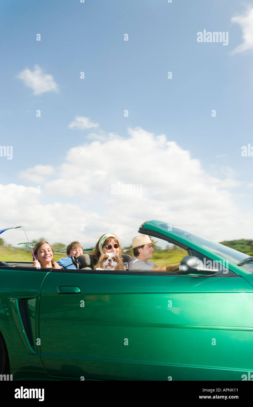Family riding in convertible car Stock Photo - Alamy