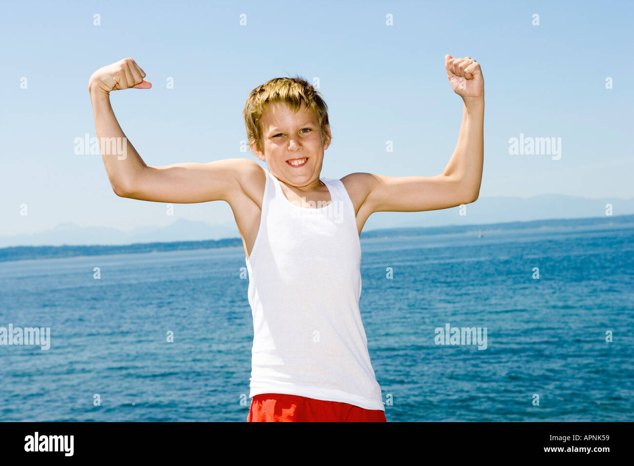 Kids flexing muscle hi-res stock photography and images - Alamy