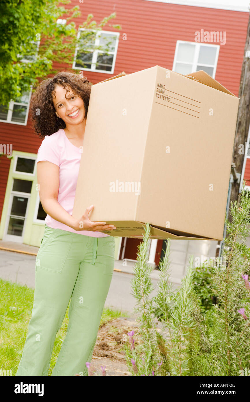 Woman posing with big moving box Stock Photo - Alamy