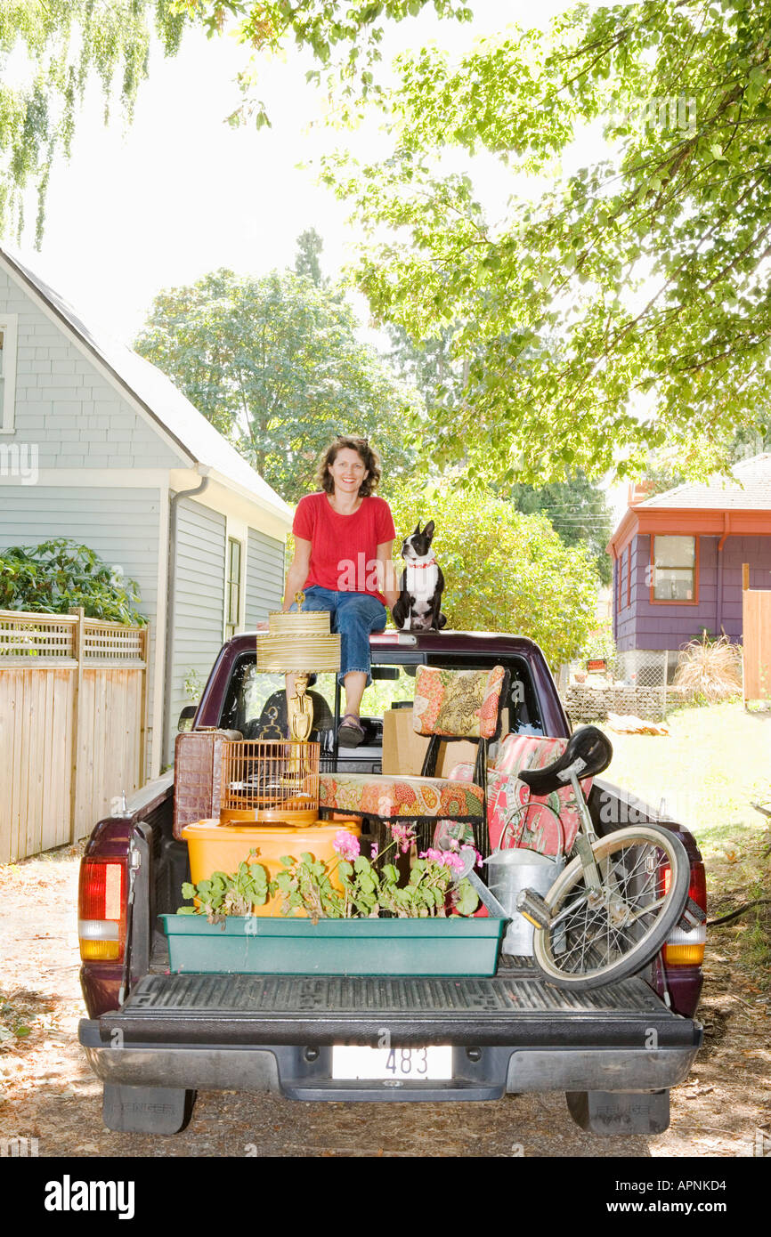 Woman with loaded pickup and dog Stock Photo - Alamy