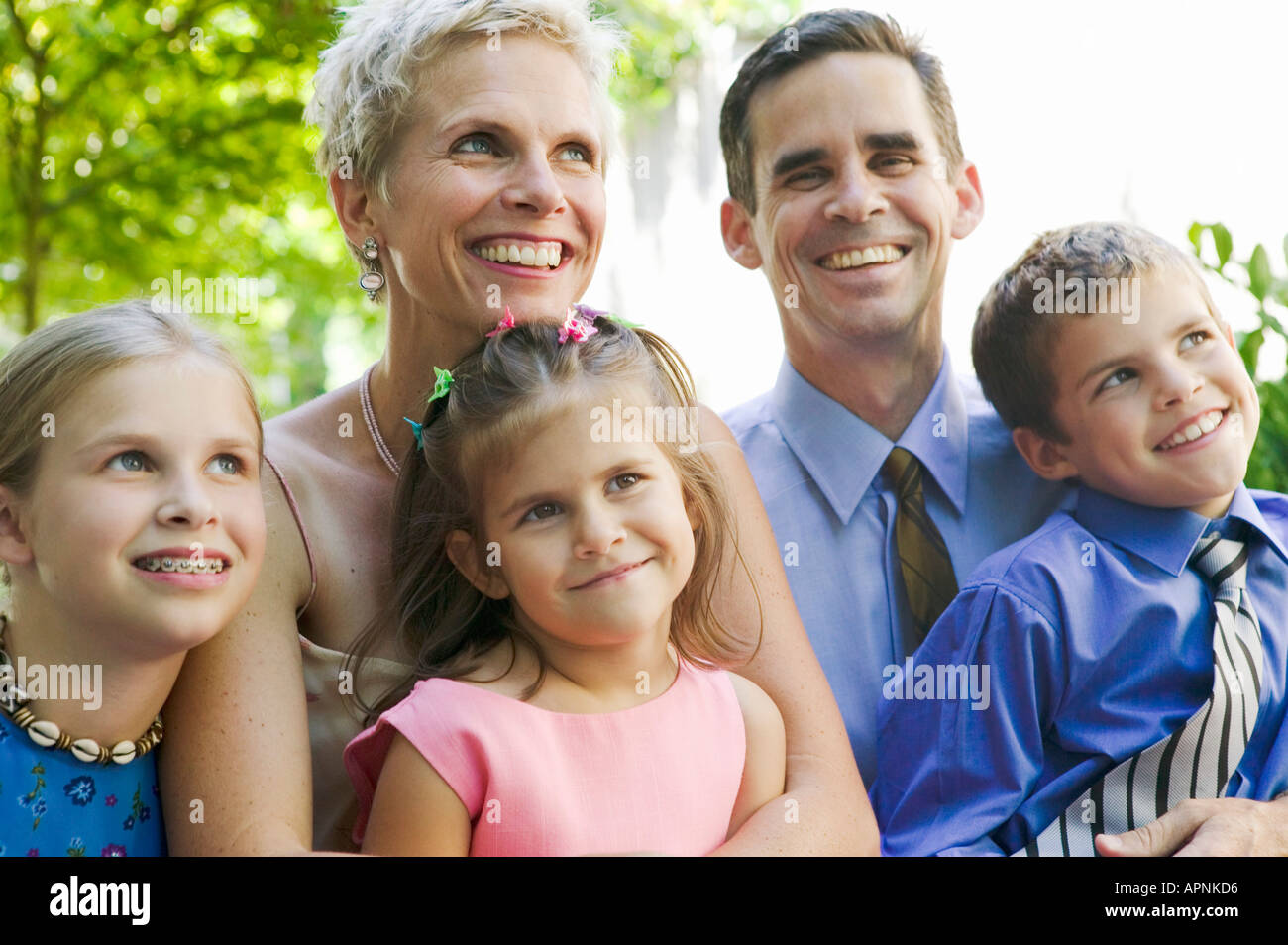 Portrait of family with three children Stock Photo - Alamy