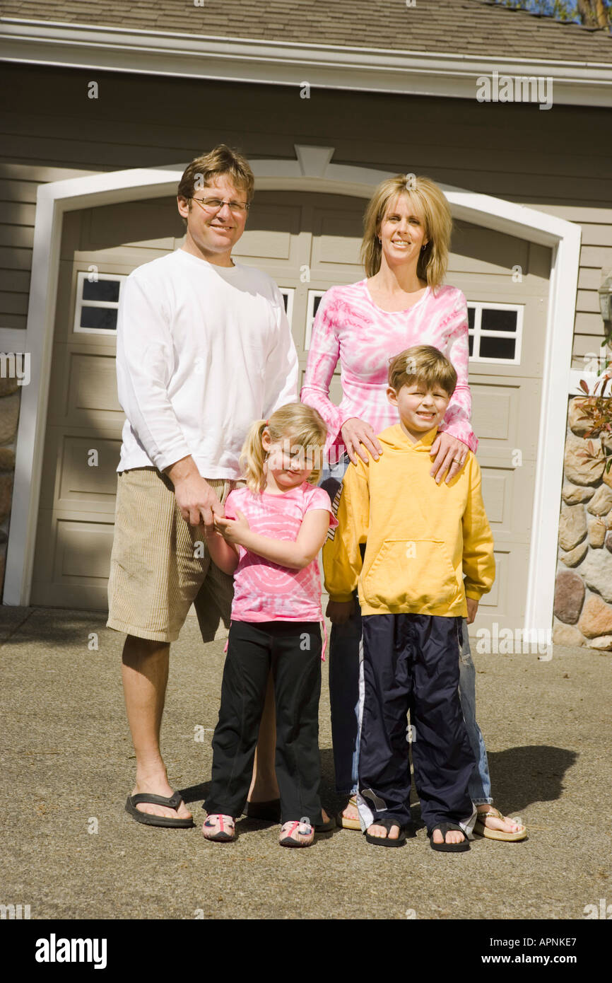 Family portrait outside house Stock Photo - Alamy