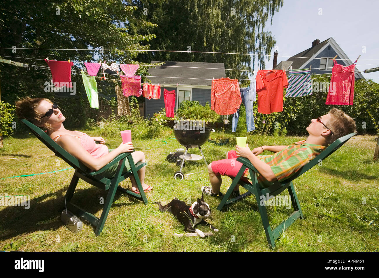 Couple Sunbathing In Back Yard Stock Photo Alamy Couple Sunbathing In Back Yard Stock Photo Alamy