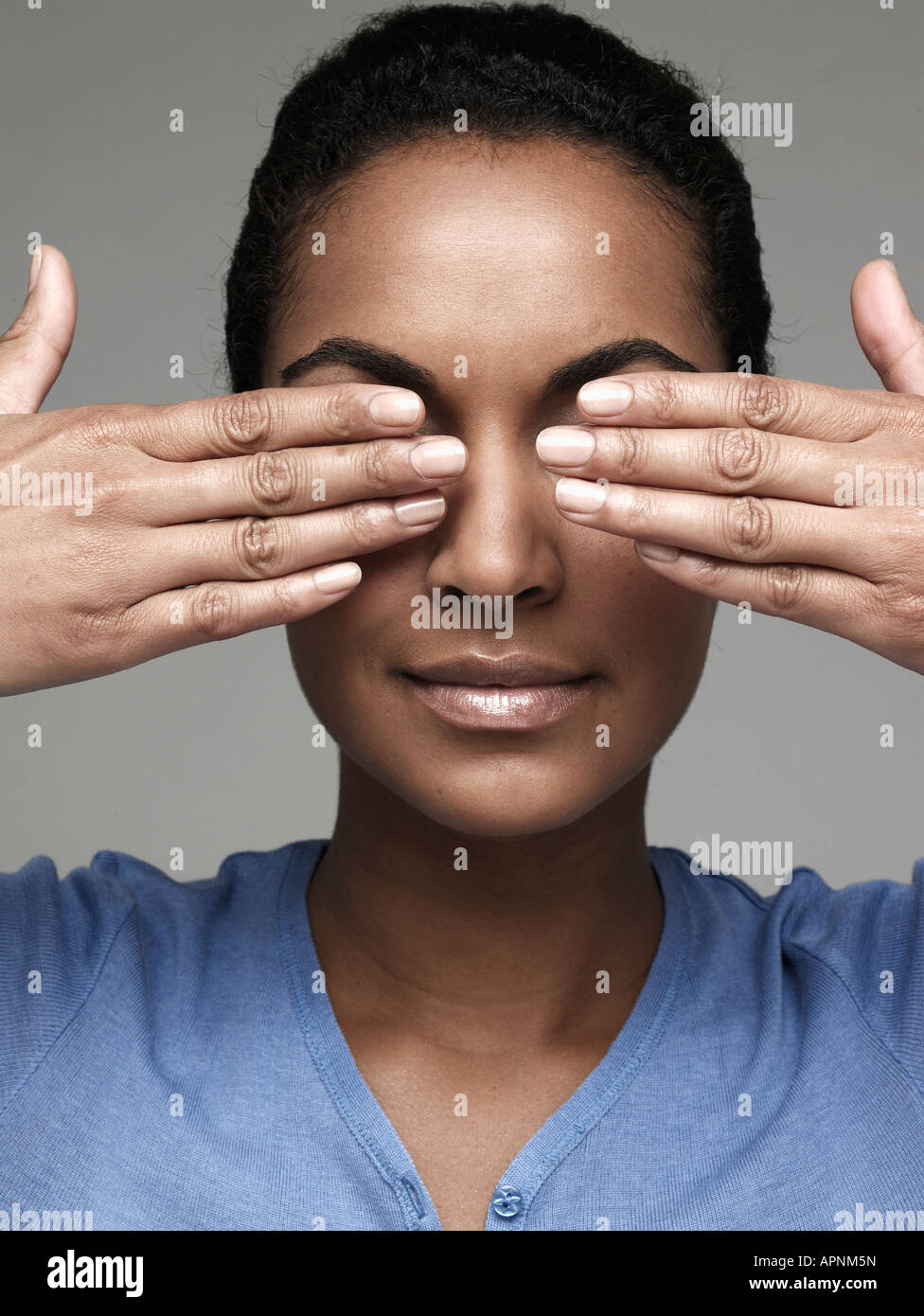 Young woman covering eyes with hands Stock Photo - Alamy