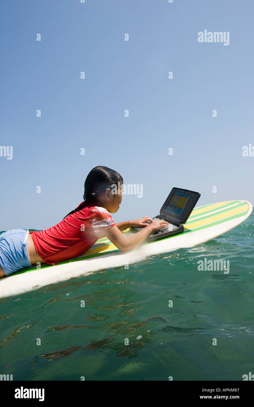 Asian female surfing ocean hi-res stock photography and images - Alamy