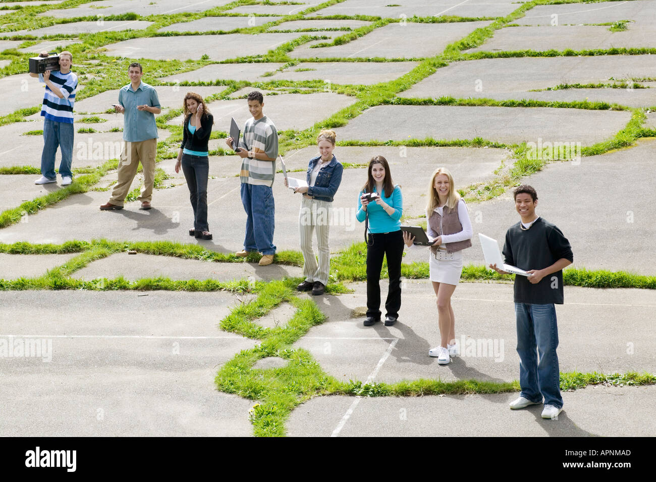 Teenagers holding electronic gadgets Stock Photo - Alamy