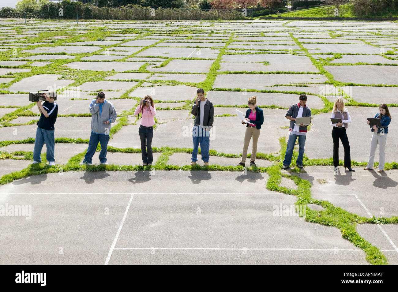 Teenagers using electronic gadgets Stock Photo - Alamy
