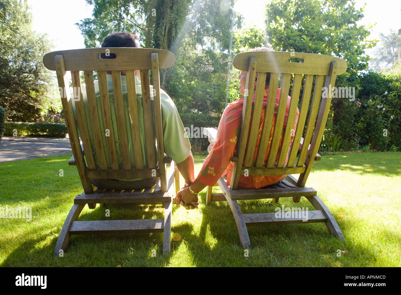 Couple holding hands outside Stock Photo - Alamy
