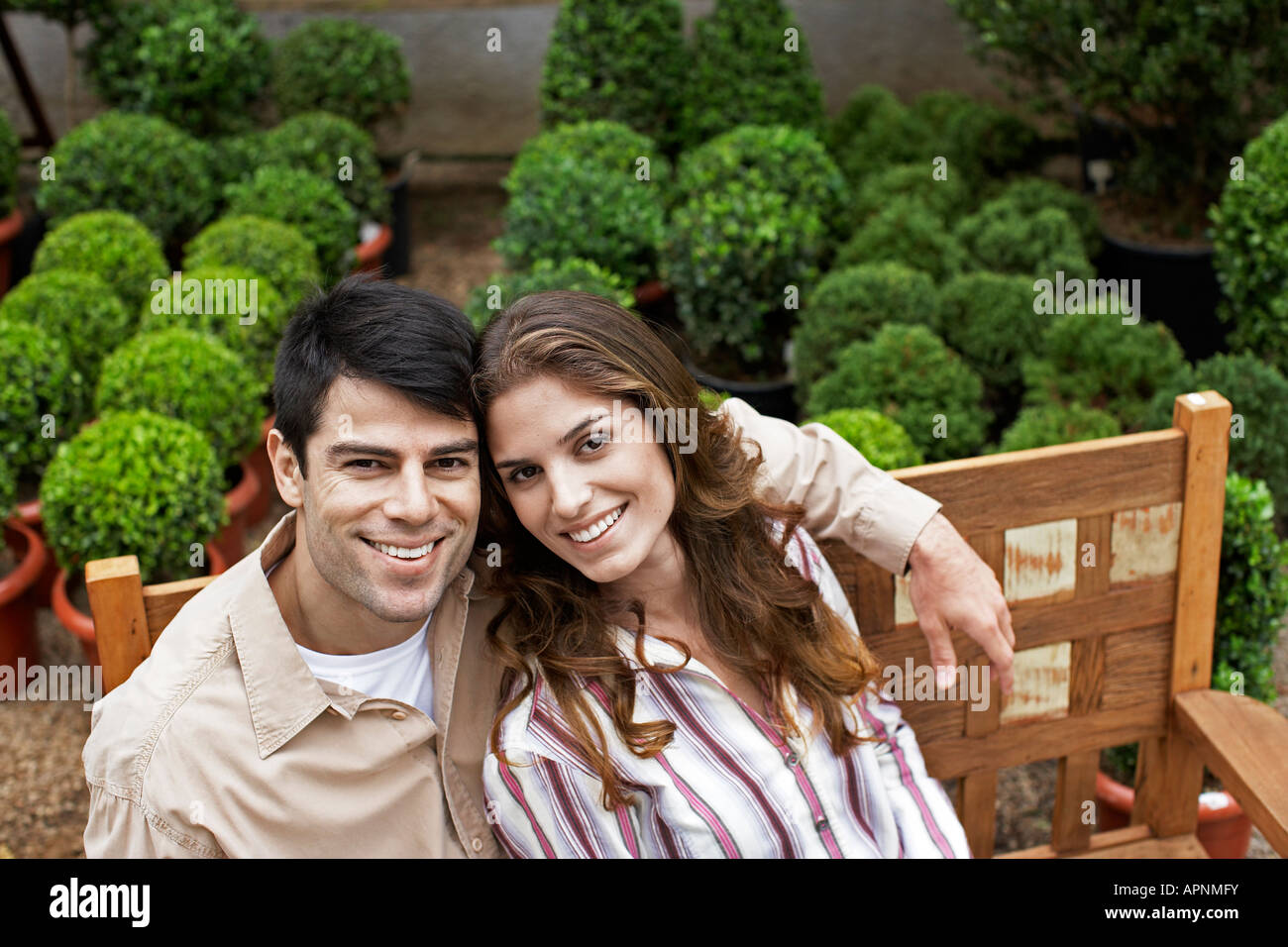 Young couple sitting on bench (high angle view Stock Photo - Alamy