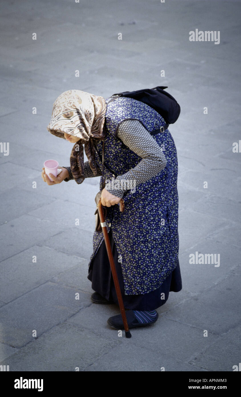 Female beggar hi-res stock photography and images - Alamy