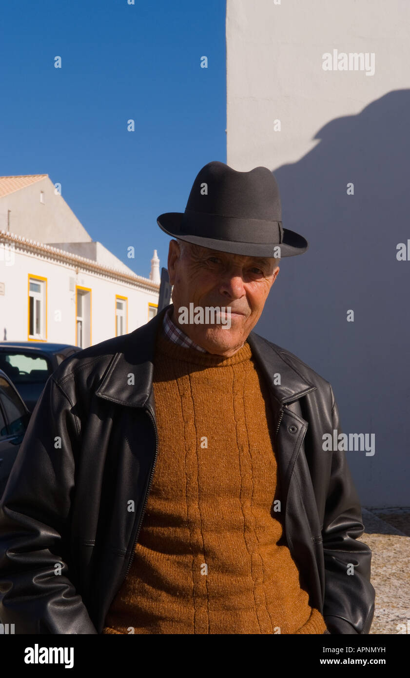 Local man in hat after church in the beautiful Algarve village of Vila ...