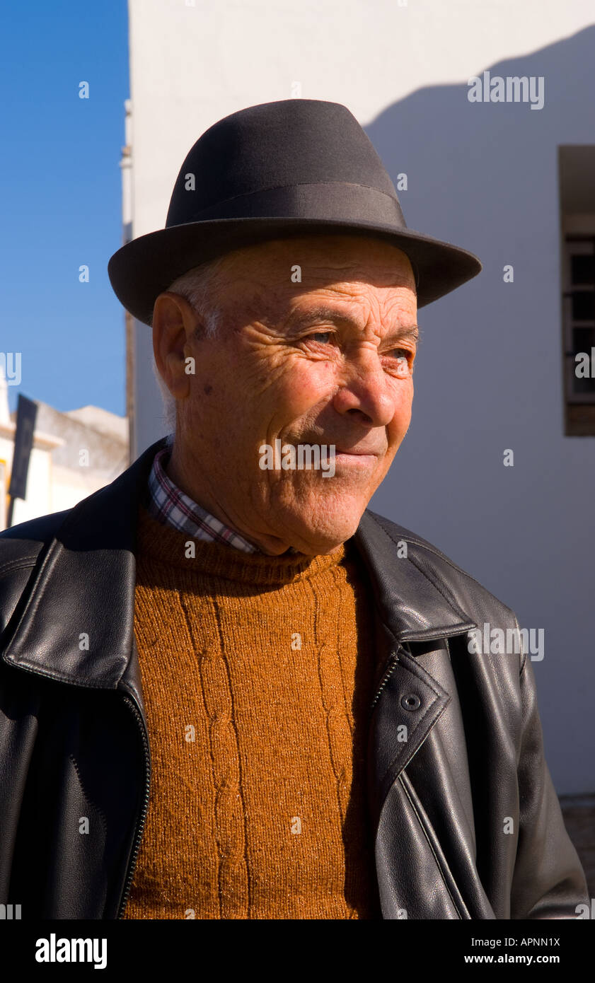 Local man in hat after church in the beautiful Algarve village of Vila ...