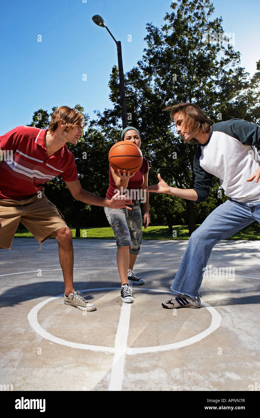 Three People Playing Basketball Stock Photo - Alamy