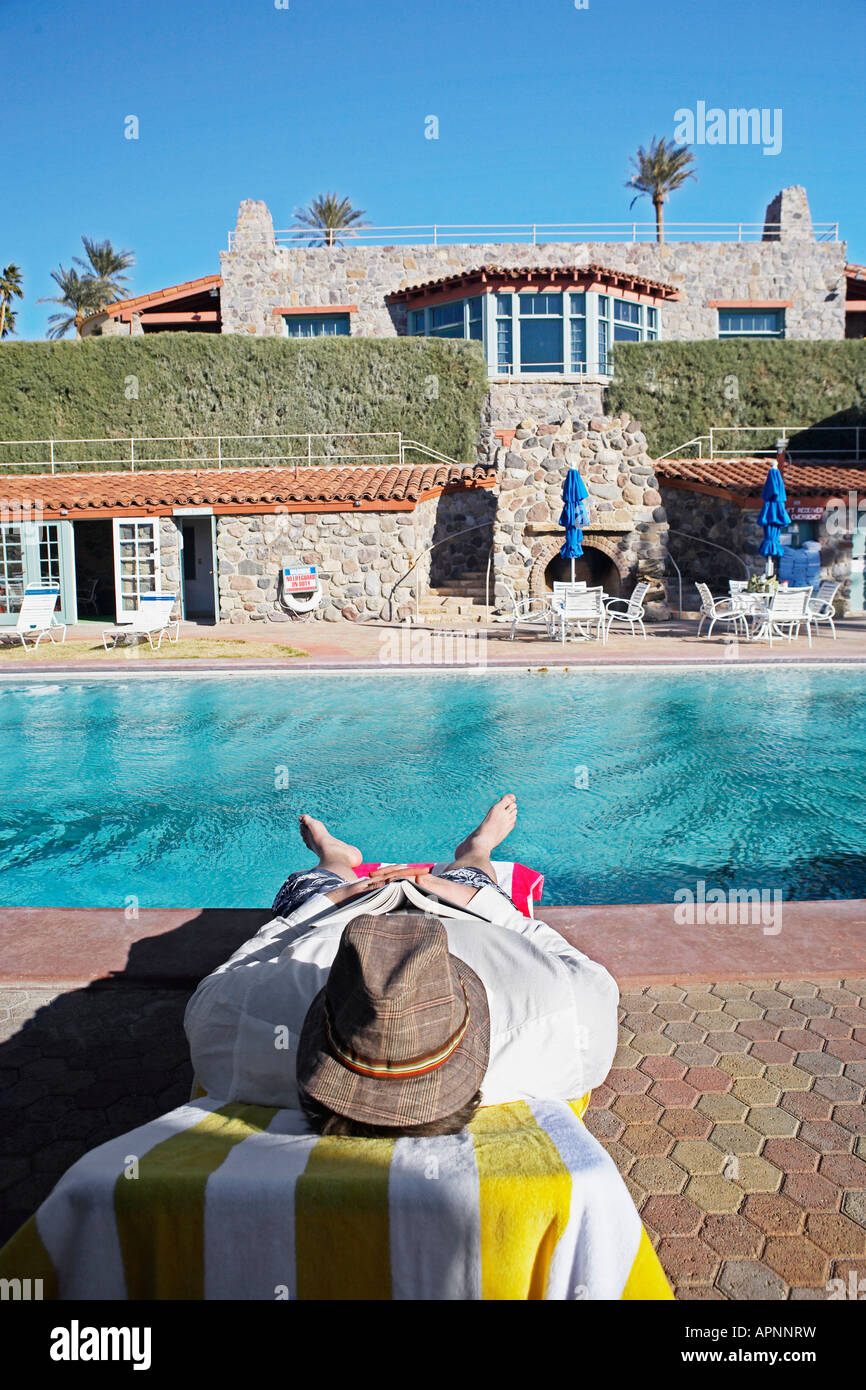 Man sleeping swimming pool hi-res stock photography and images - Alamy