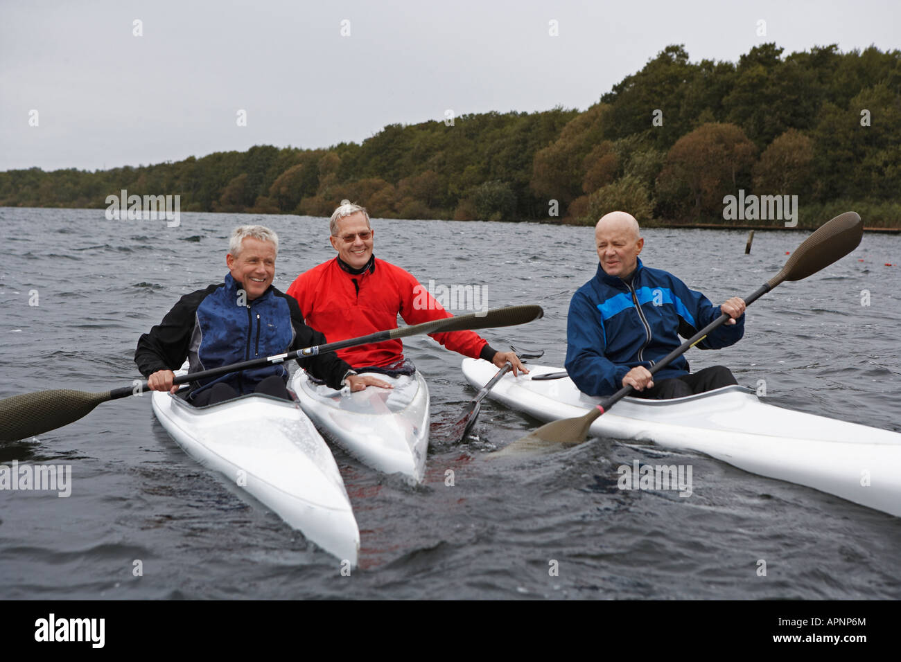 Three Middle-Aged Men Kayaking Stock Photo - Alamy