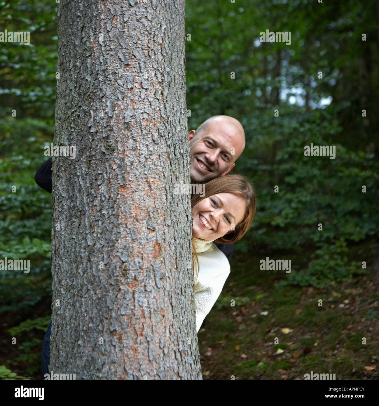 Women behind men hi-res stock photography and images - Alamy